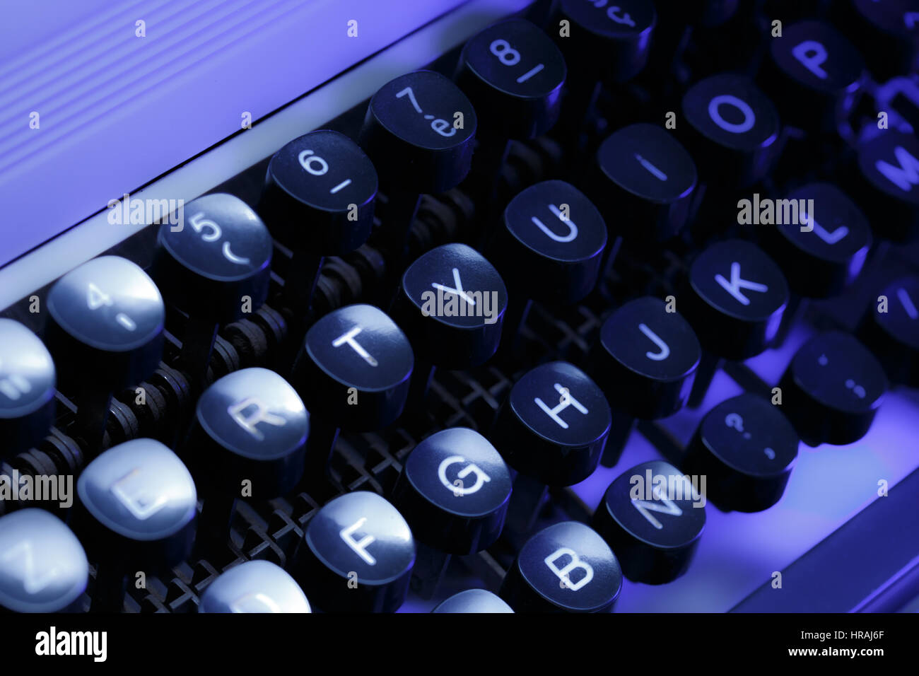 Keyboard of typewriter in blue toning Stock Photo - Alamy