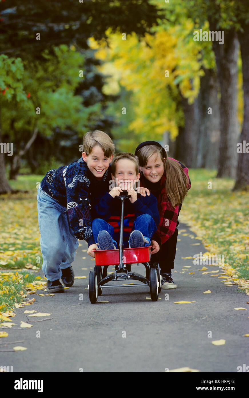 Children playing with wagon Stock Photo - Alamy
