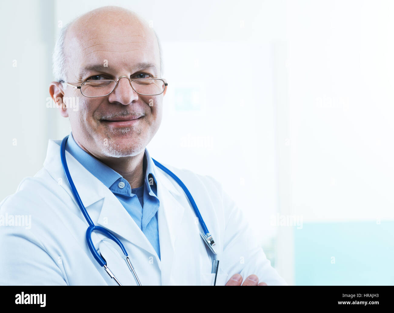 Friendly doctor smiling and looking at camera Stock Photo - Alamy