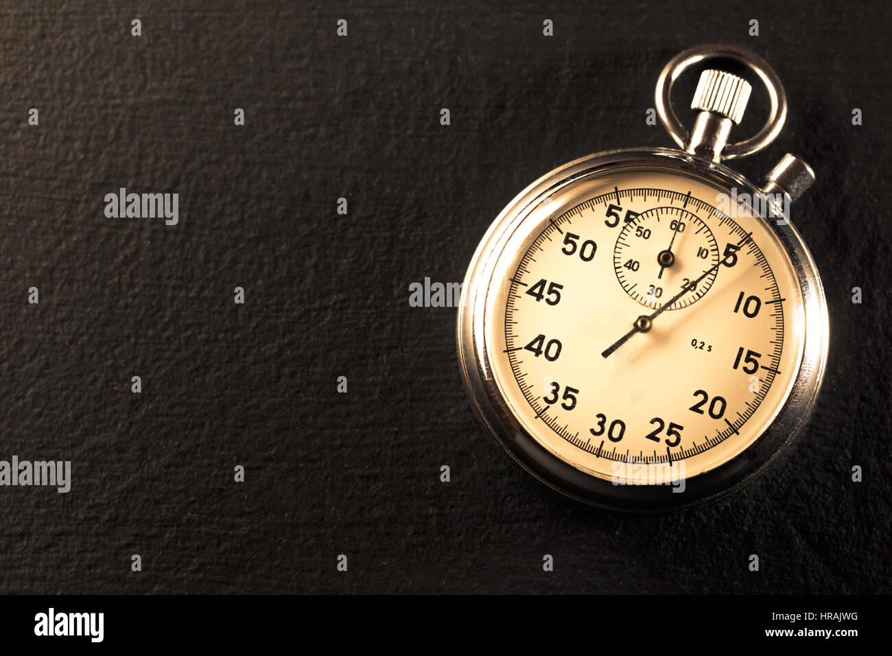 Stopwatch on black background in closeup Stock Photo - Alamy