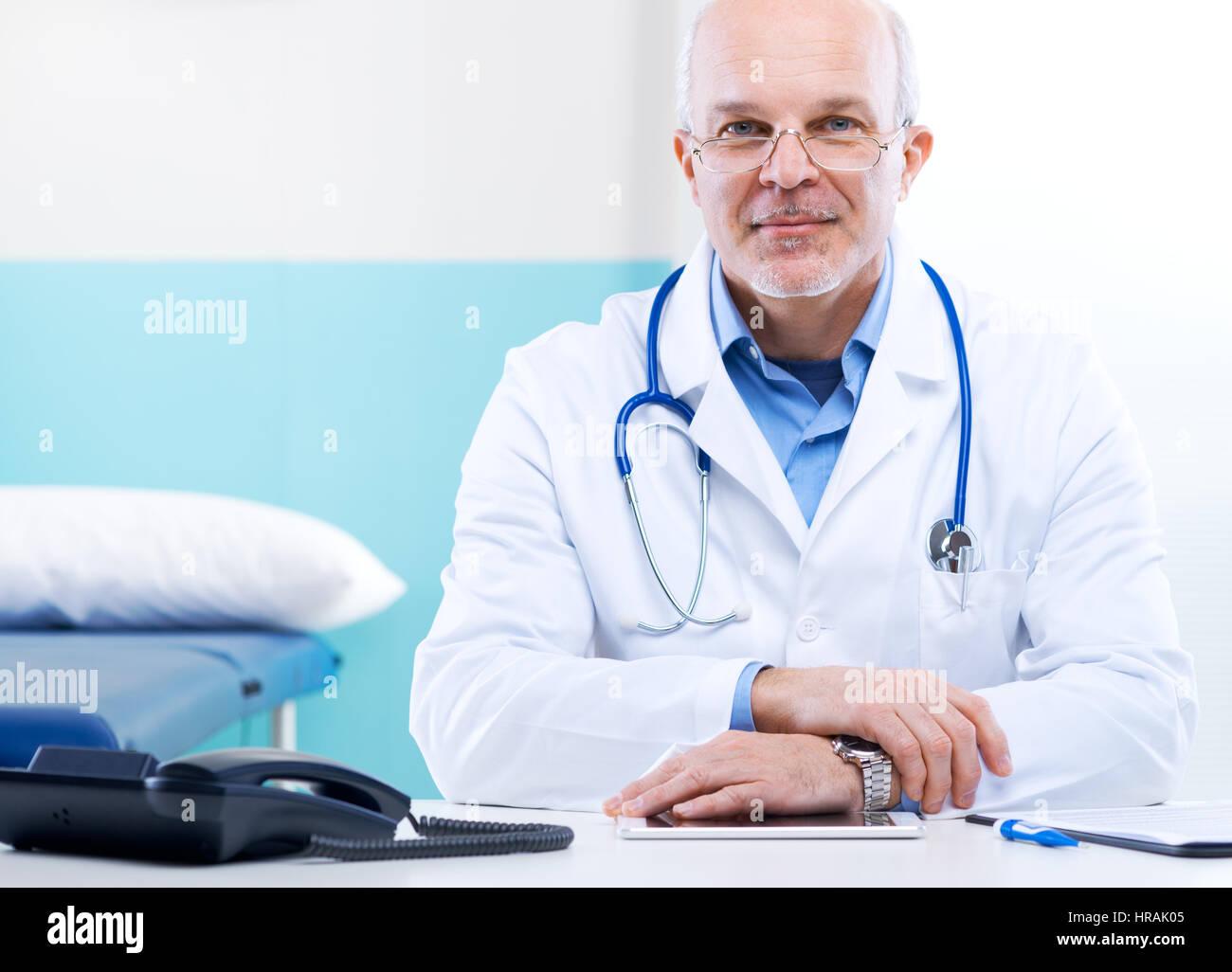 Doctor working looking medical documents hi-res stock photography and ...