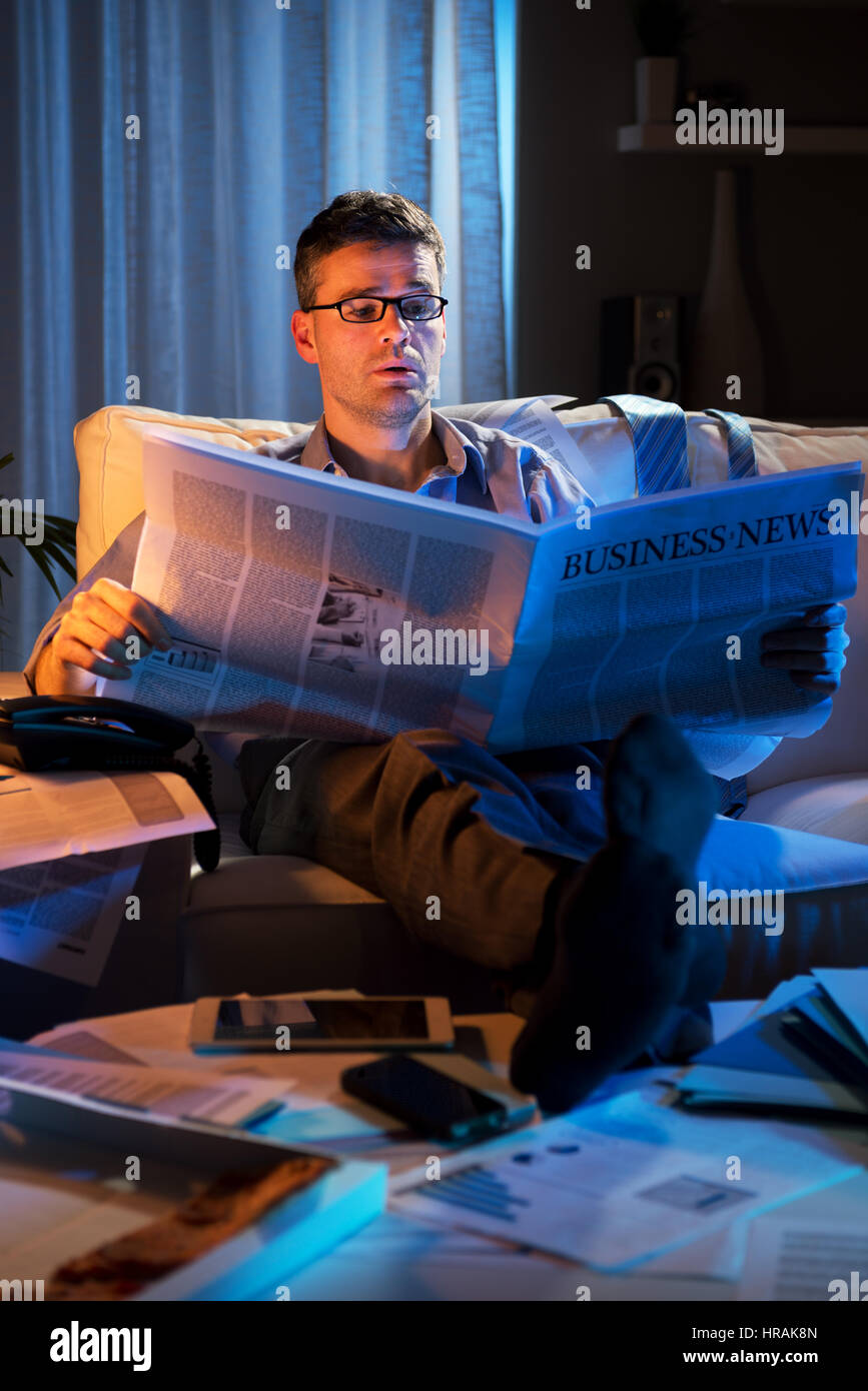 Reading financial newspaper hi-res stock photography and images - Alamy