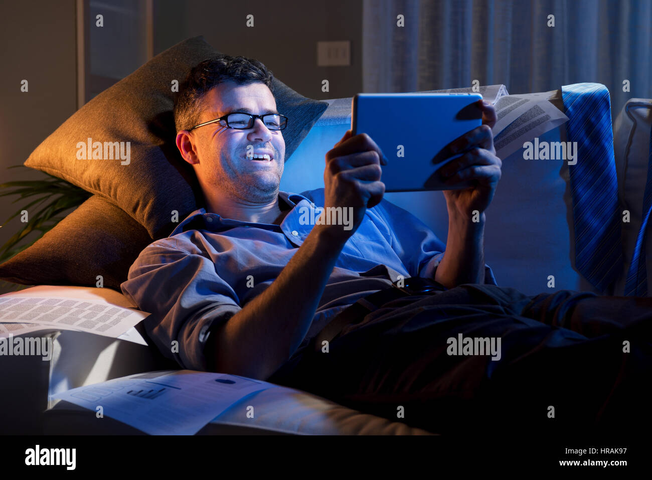 Businessman lying on couch working hi-res stock photography and images ...
