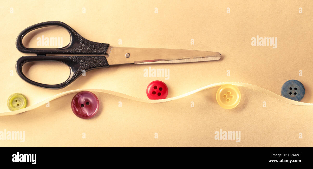 Colourful buttons, scissors and decorative ribbon in closeup Stock ...