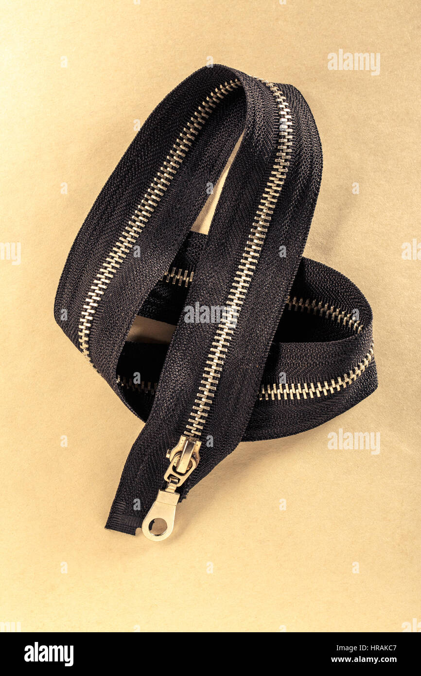 Black zipper on the paper background Stock Photo - Alamy