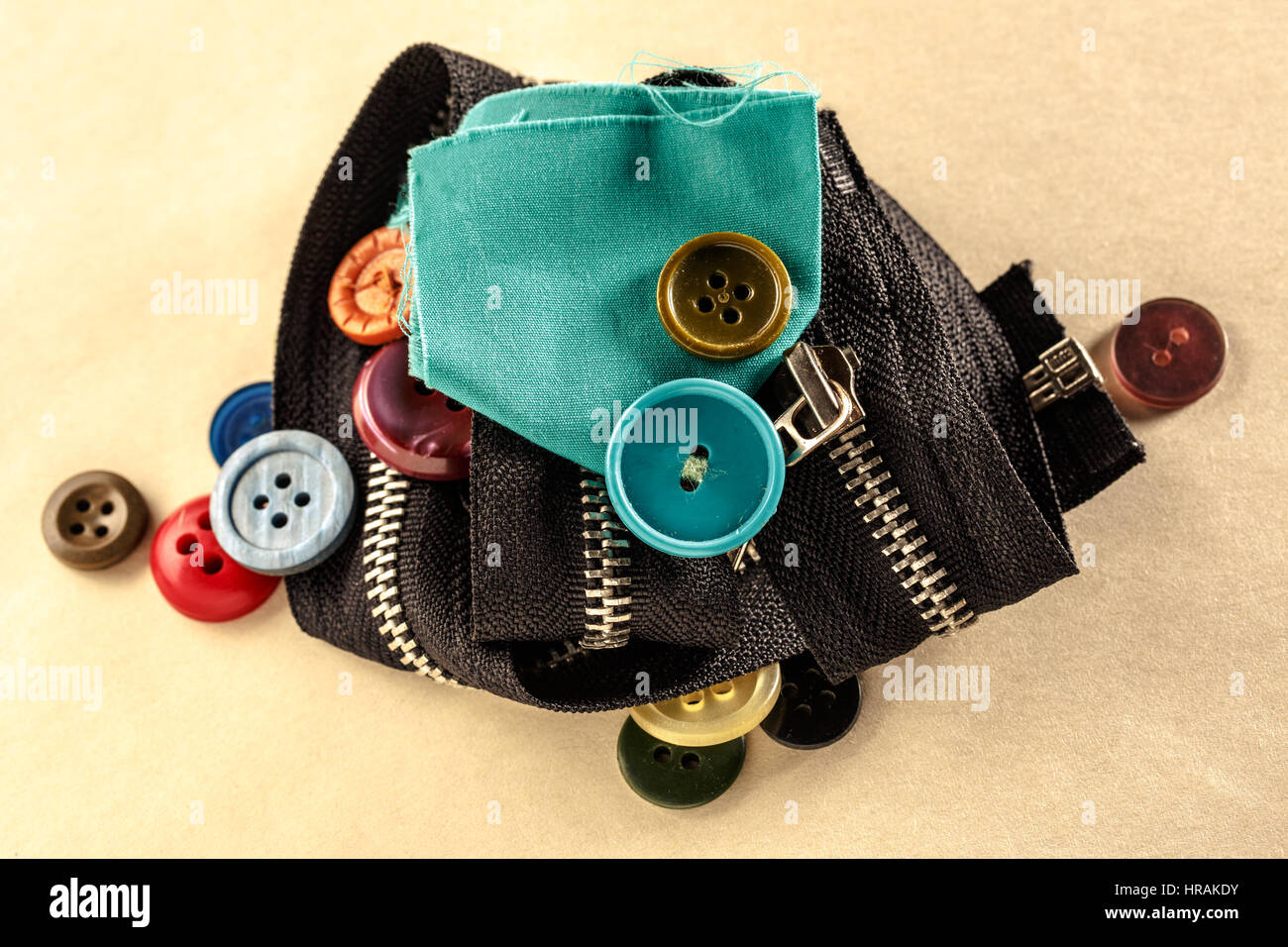 Colourful buttons, zipper and cloth in closeup Stock Photo - Alamy