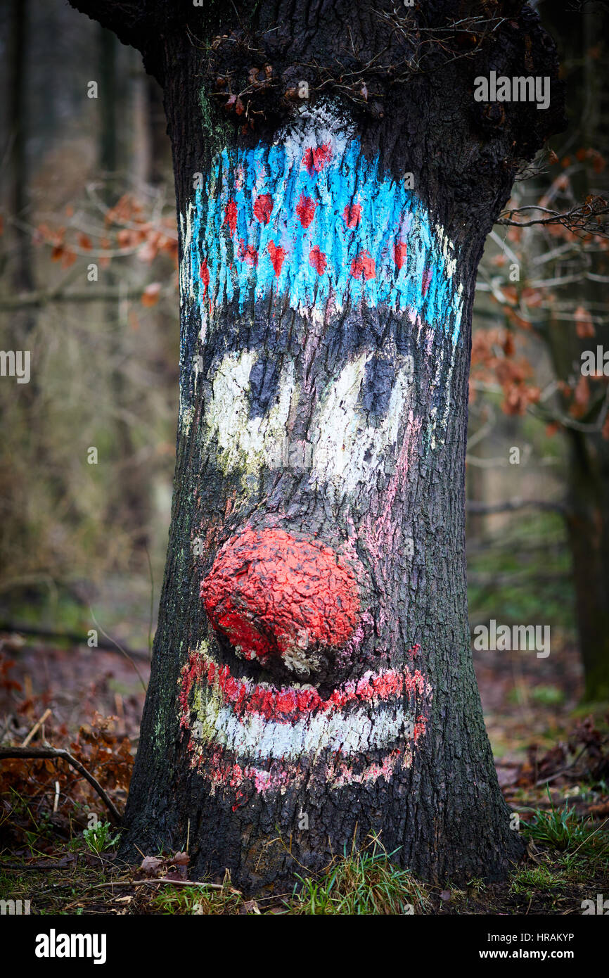 Hand painted happy clown style face artwork enlarge tree with its own ...