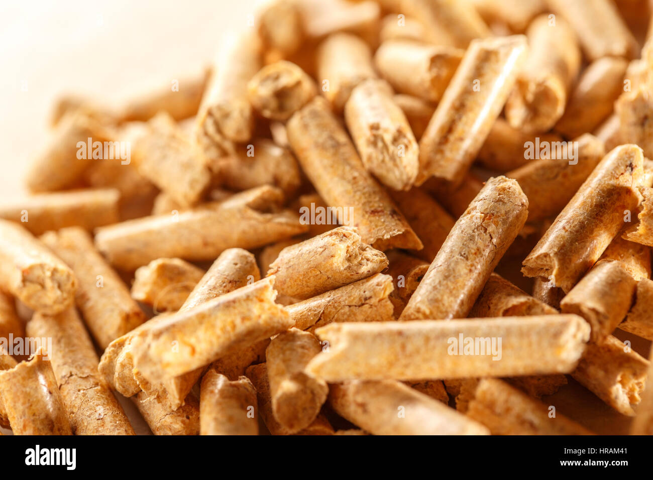 Wooden pellets on paper background in closeup Stock Photo - Alamy