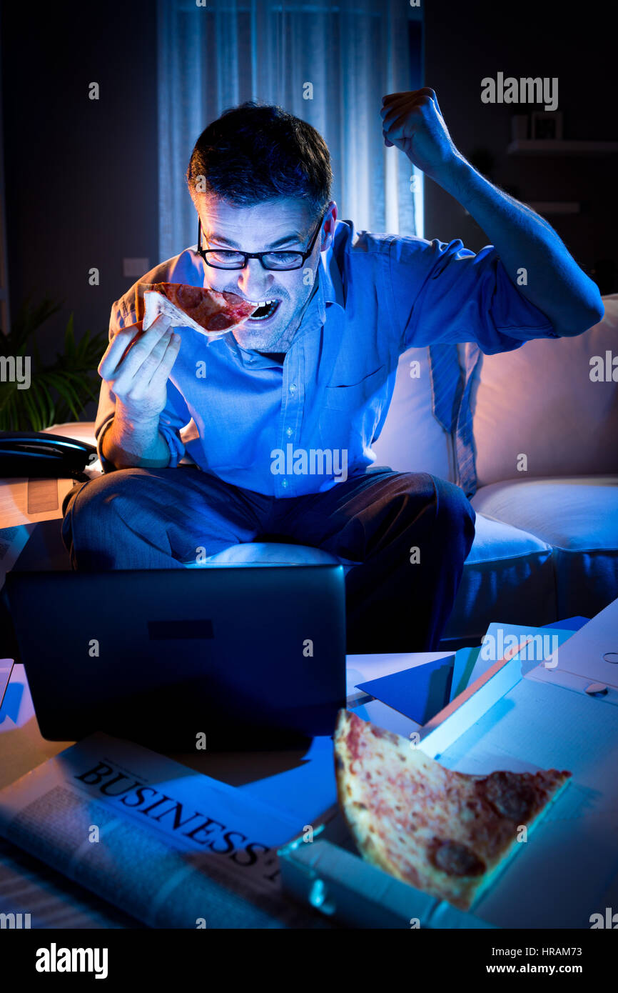 Messy man eating pizza hi-res stock photography and images - Alamy