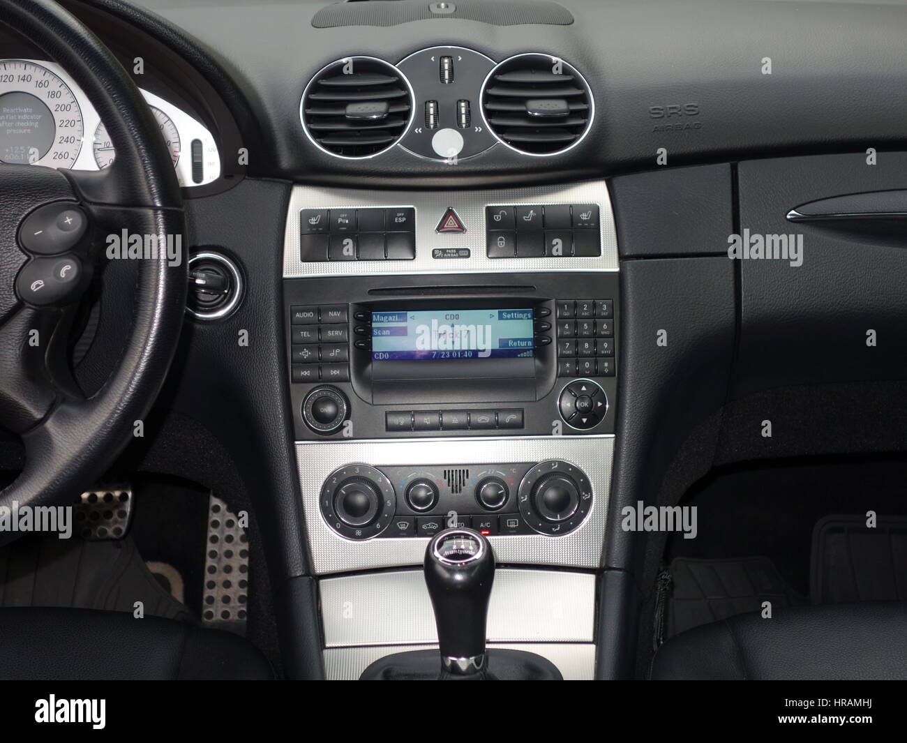View of central panel dashboard unit with audio controls and ...