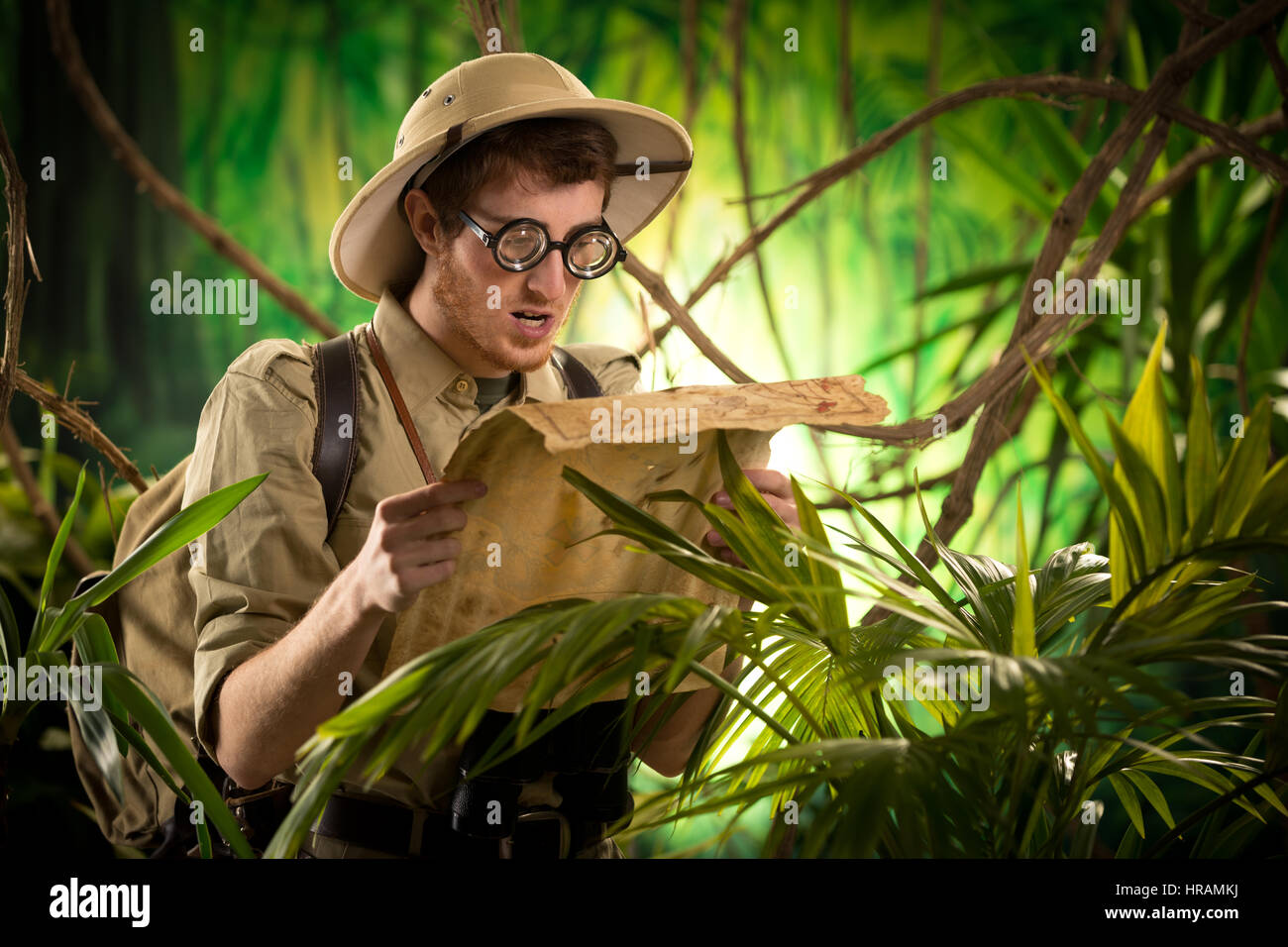 Old explorer holding map hi-res stock photography and images - Alamy