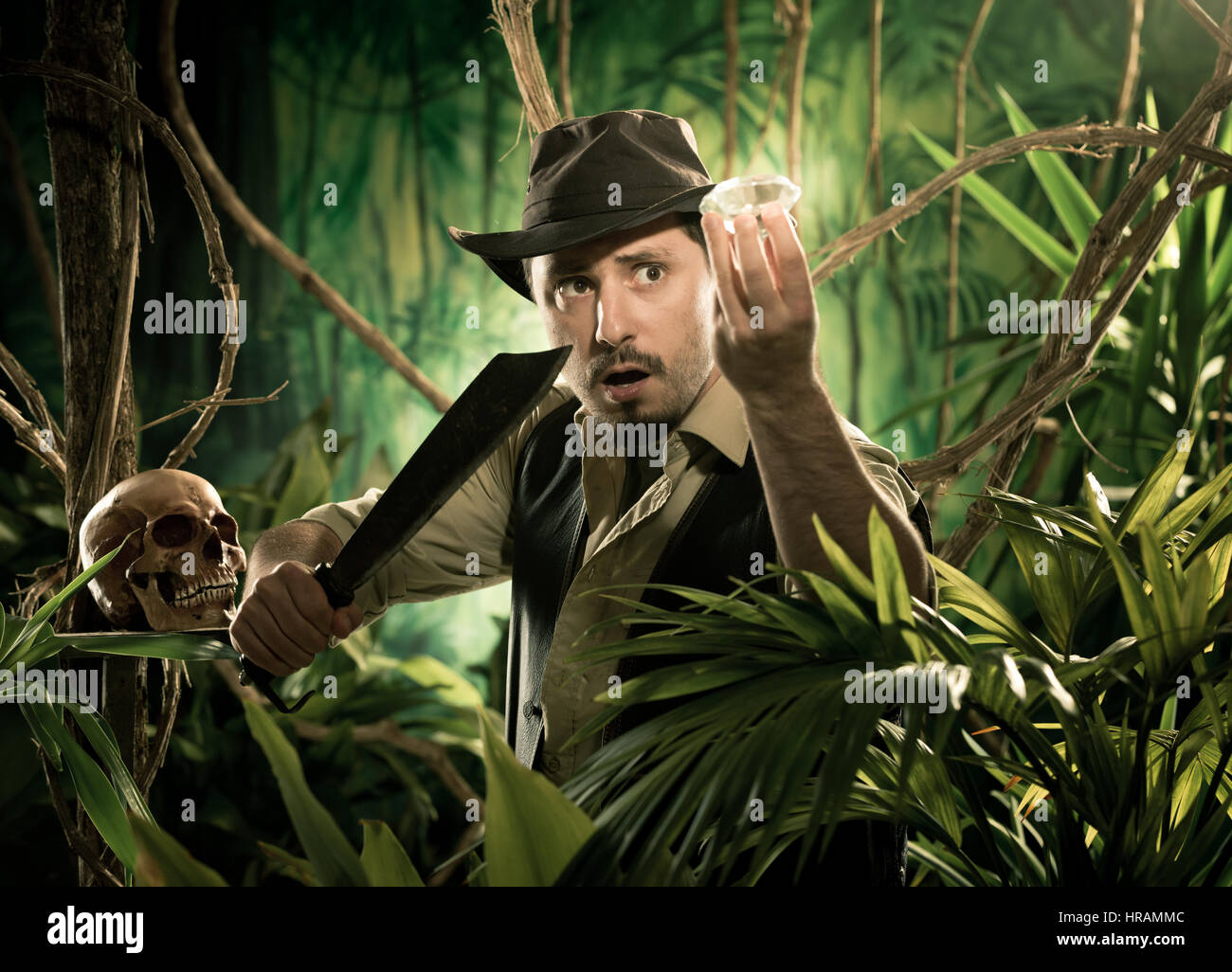 Adventurer with machete finding a huge gem in the jungle with skull on ...