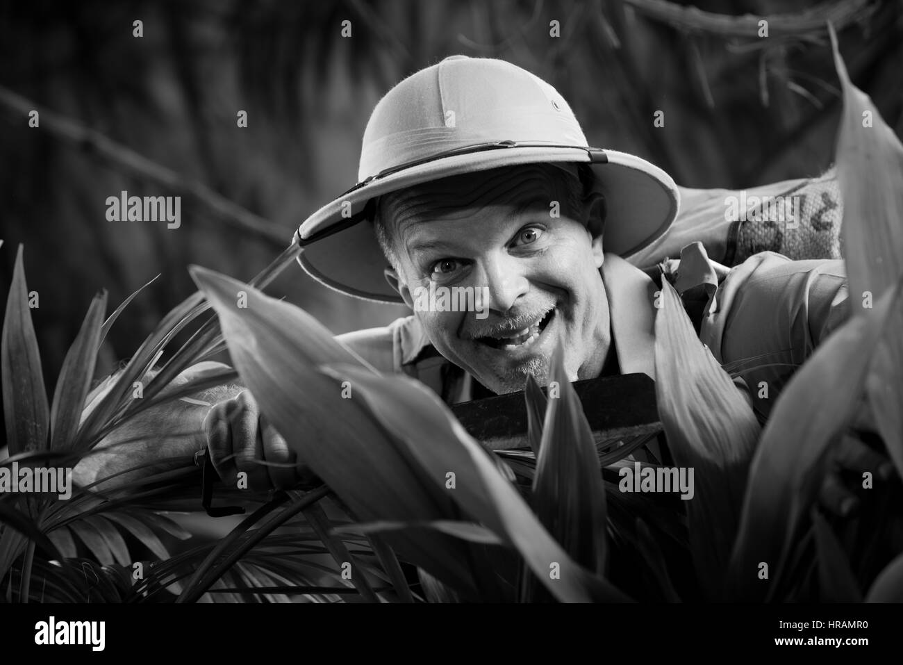 Survival confident adventurer exploring the rainforest jungle holding a ...