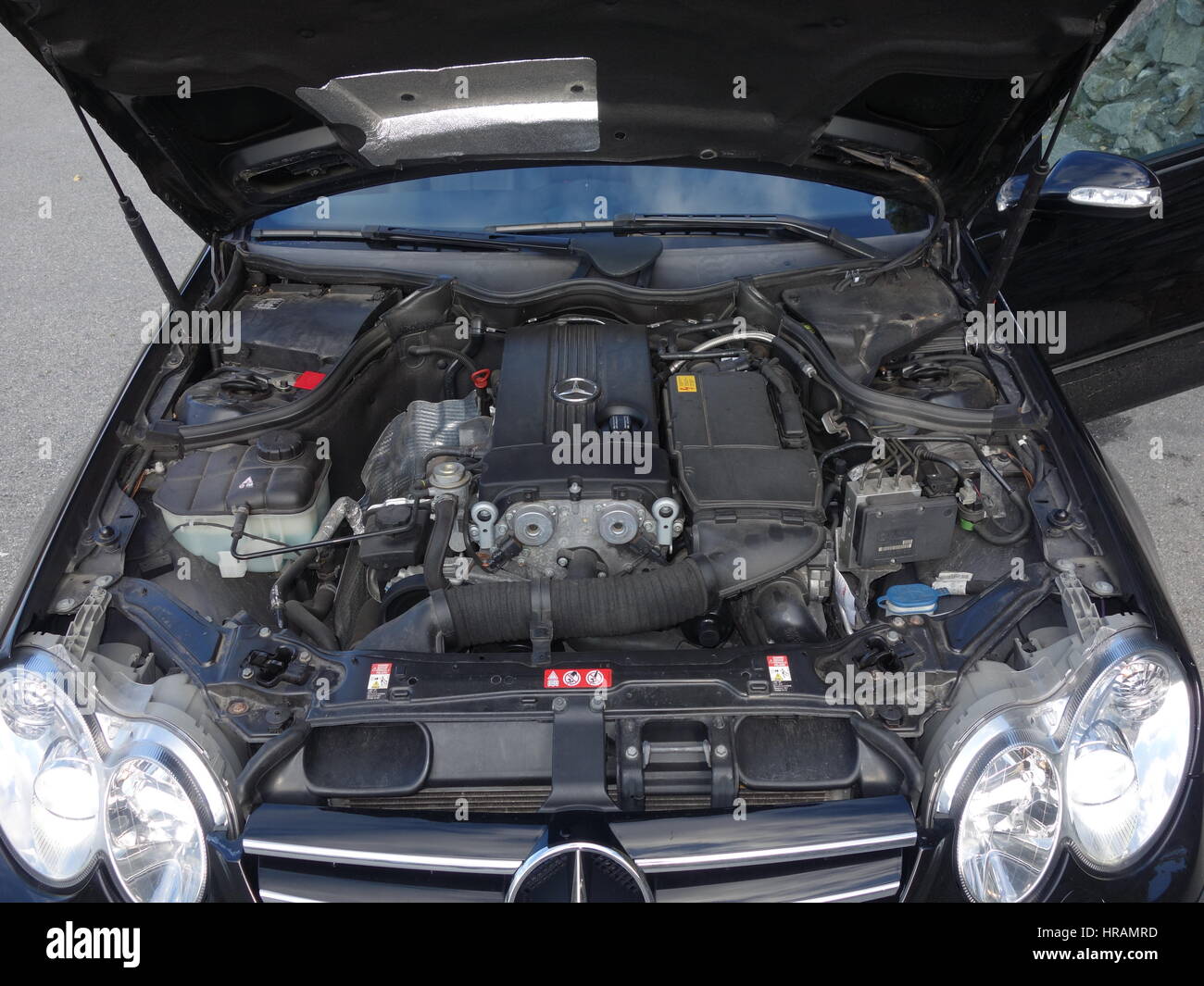 Car with hood cracked up/opened - engine repair by mechanic. Engine ...