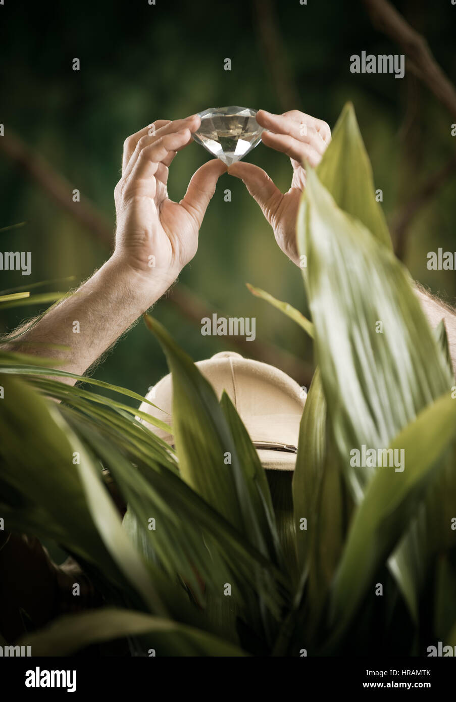 Explorer in the jungle finding a huge precious diamond Stock Photo - Alamy