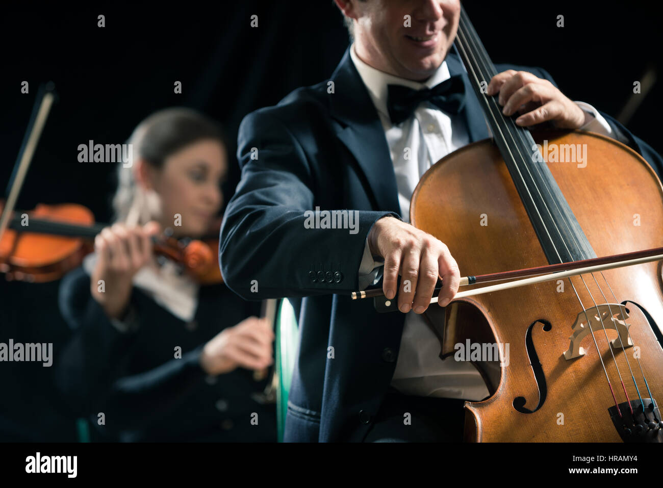 Cello player in orchestra hi-res stock photography and images - Alamy