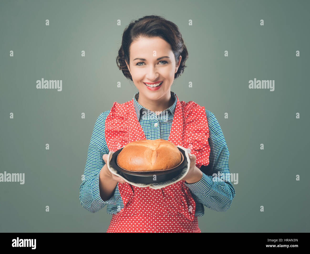 Woman holding cake 1960's hi-res stock photography and images - Alamy