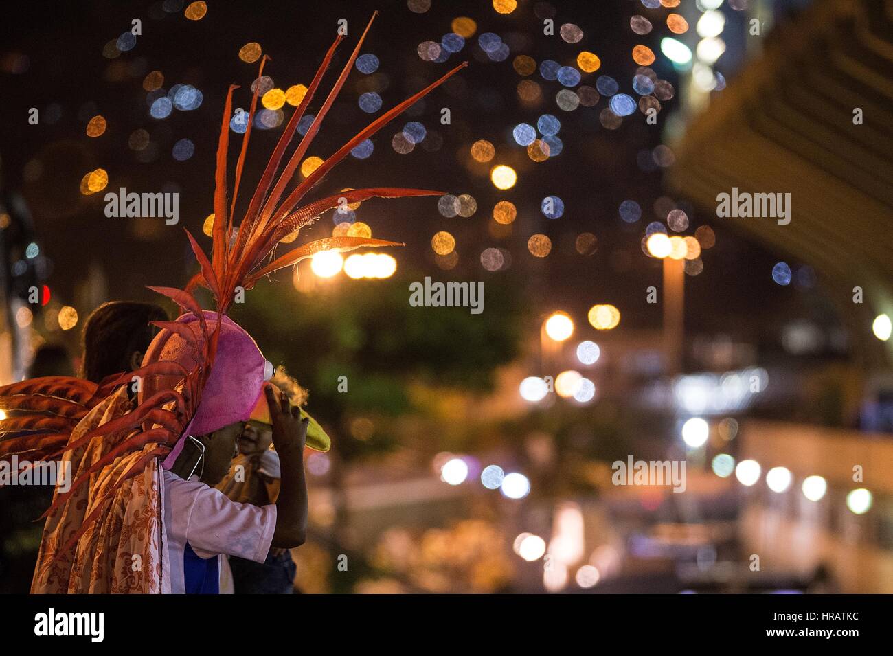 Rio De Janeiro, Brazil. 28th Feb, 2017. A teenager watches the parades ...