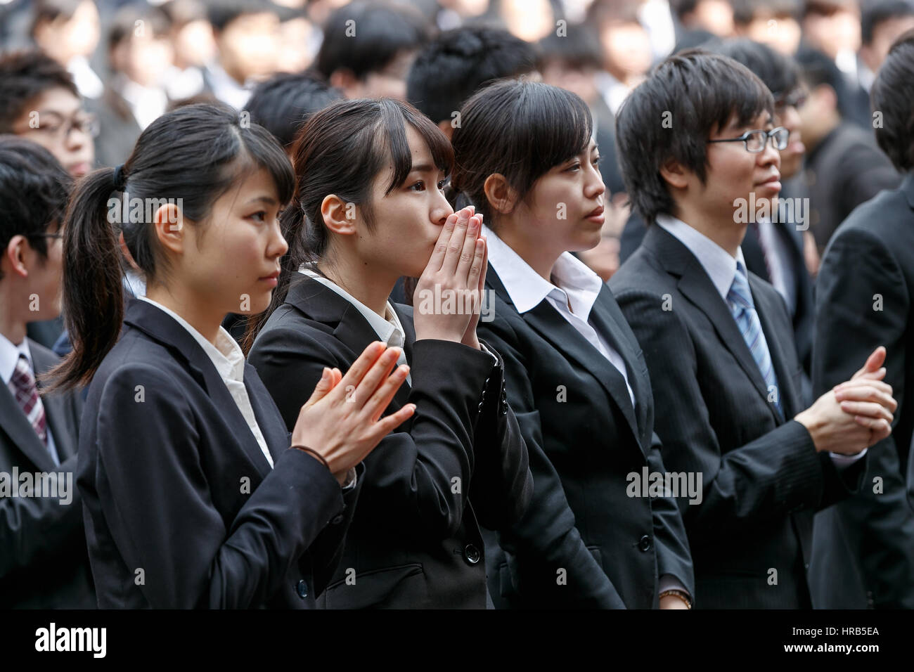 Tokyo, Japan. 1st Mar, 2017. College graduates listen to speeches ...