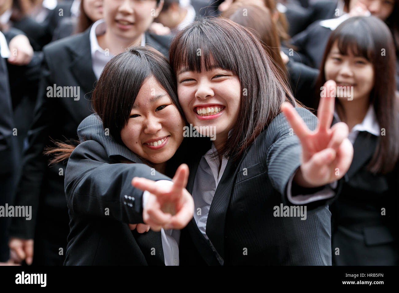 Tokyo, Japan. 1st Mar, 2017. College graduates pose for a photograph ...