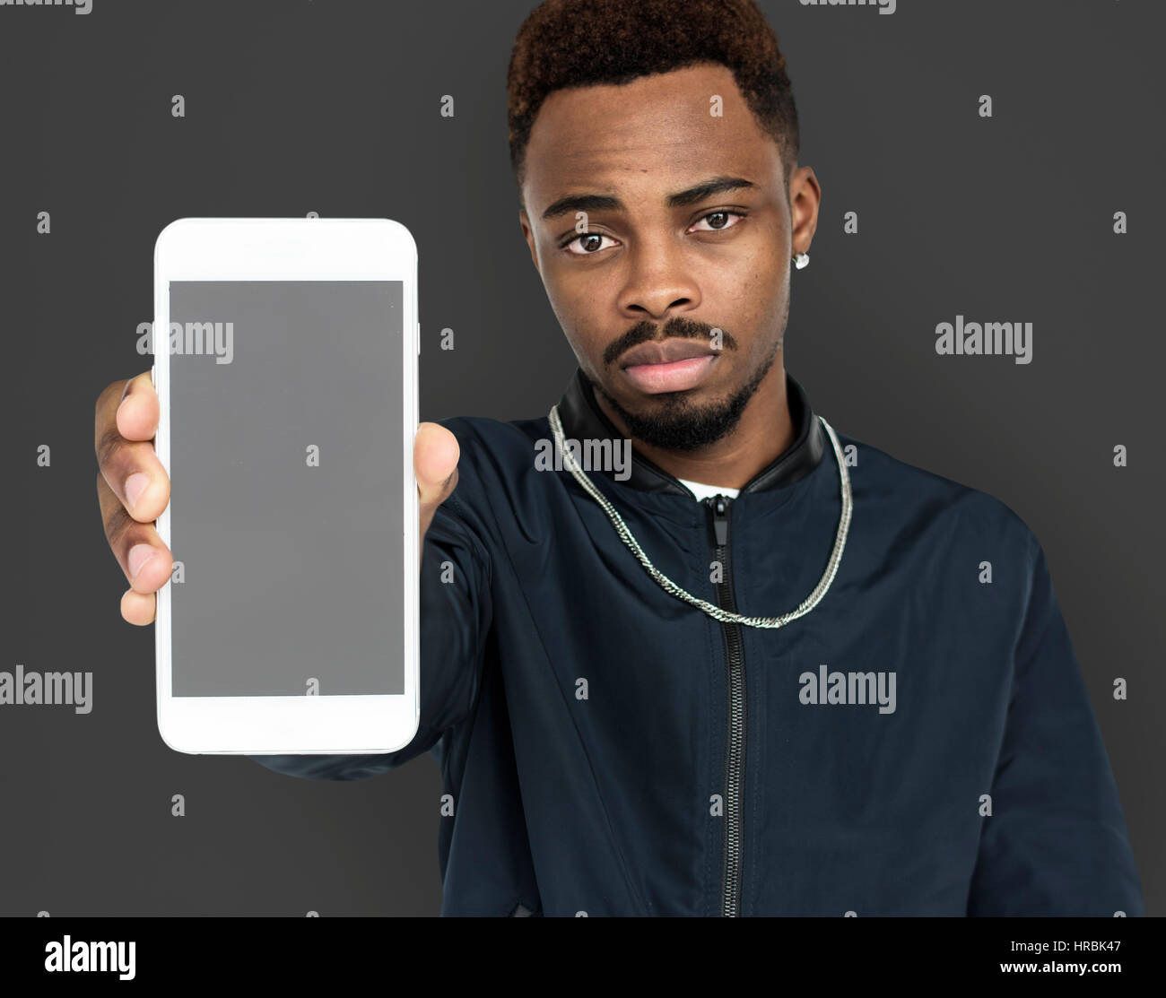 African Descent Man Holding Phone Stock Photo - Alamy