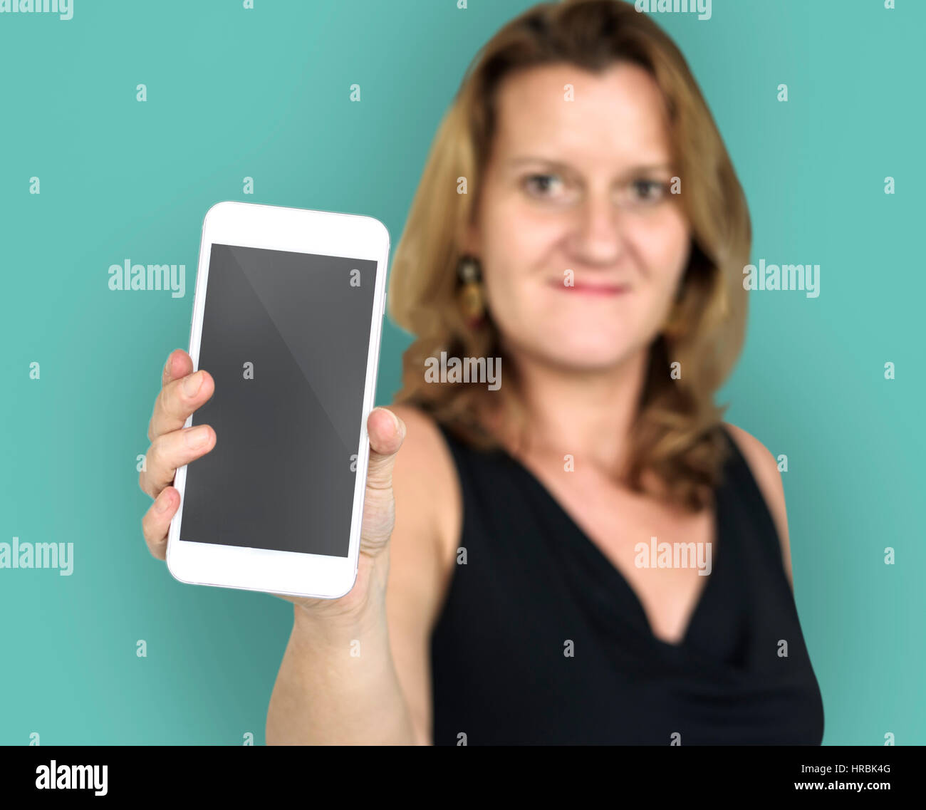 Caucasian Lady Holding Phone Smiling Stock Photo - Alamy