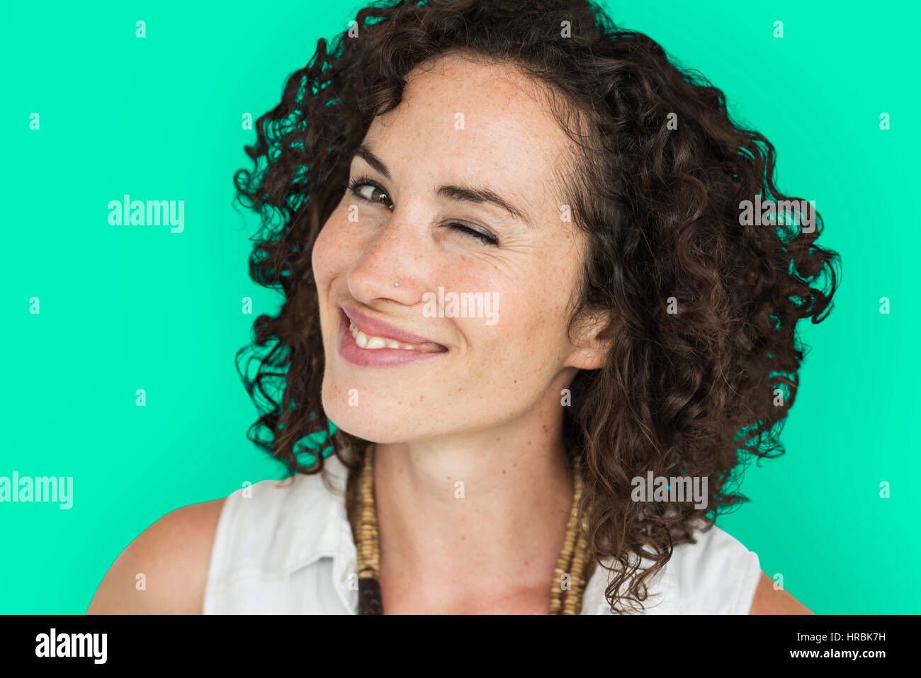 Woman winking smiling hi-res stock photography and images - Alamy