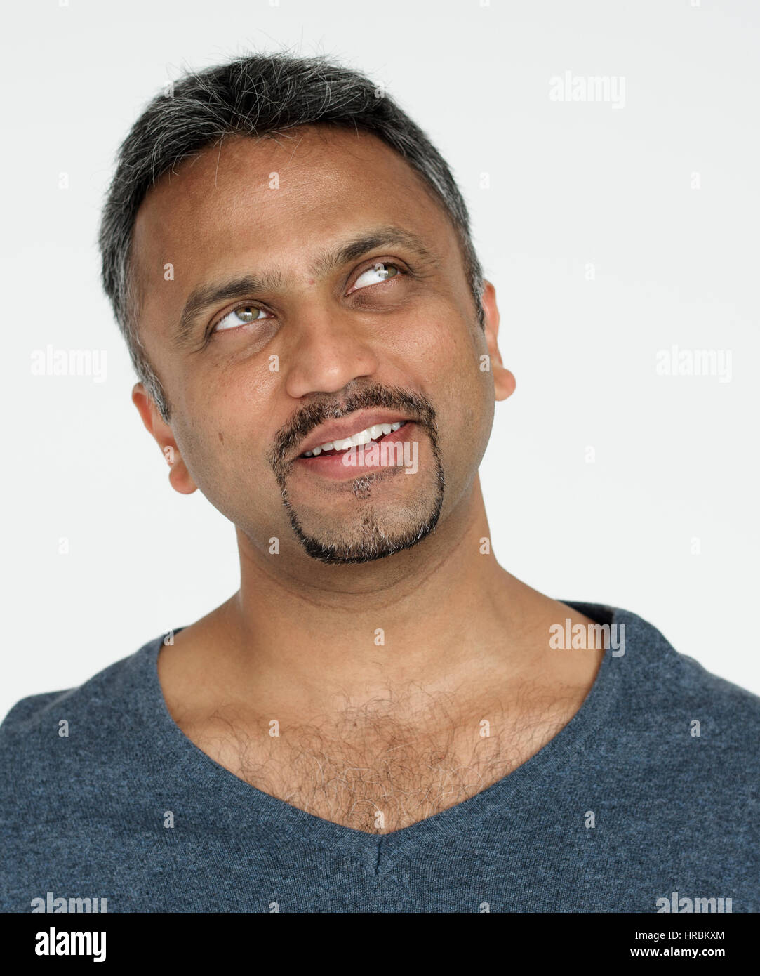 Indian guy smiling cheerful studio portrait Stock Photo - Alamy