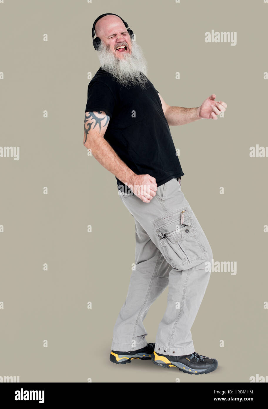 Bearded rocker guy playing air guitar portrait Stock Photo - Alamy