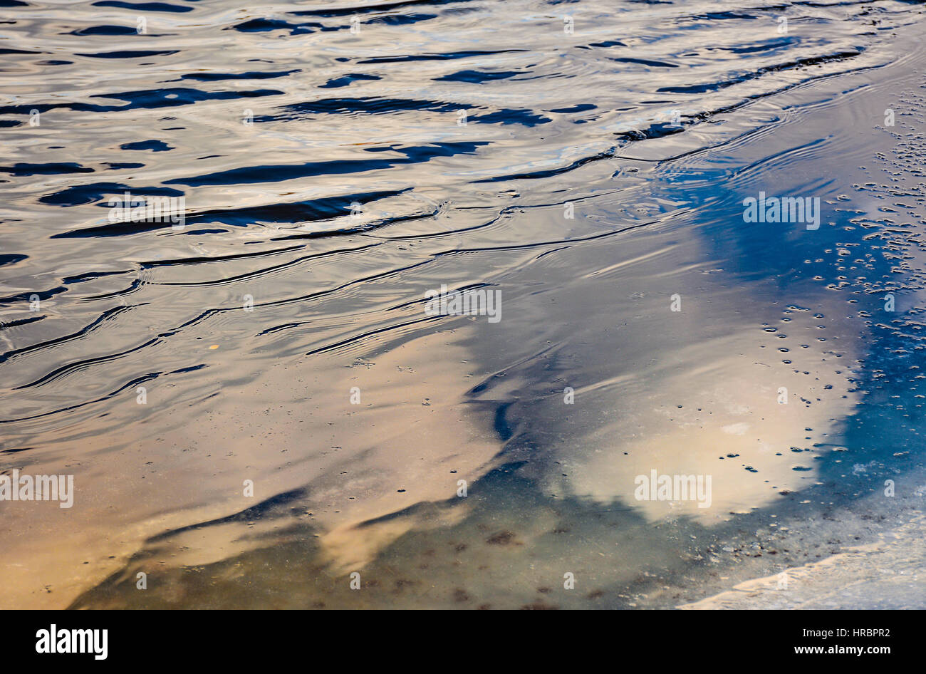The reflection of the sky in cold water Stock Photo - Alamy