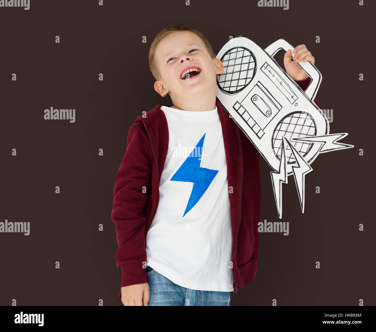 Caucasian Little Boy Holding Jukebox Stock Photo - Alamy