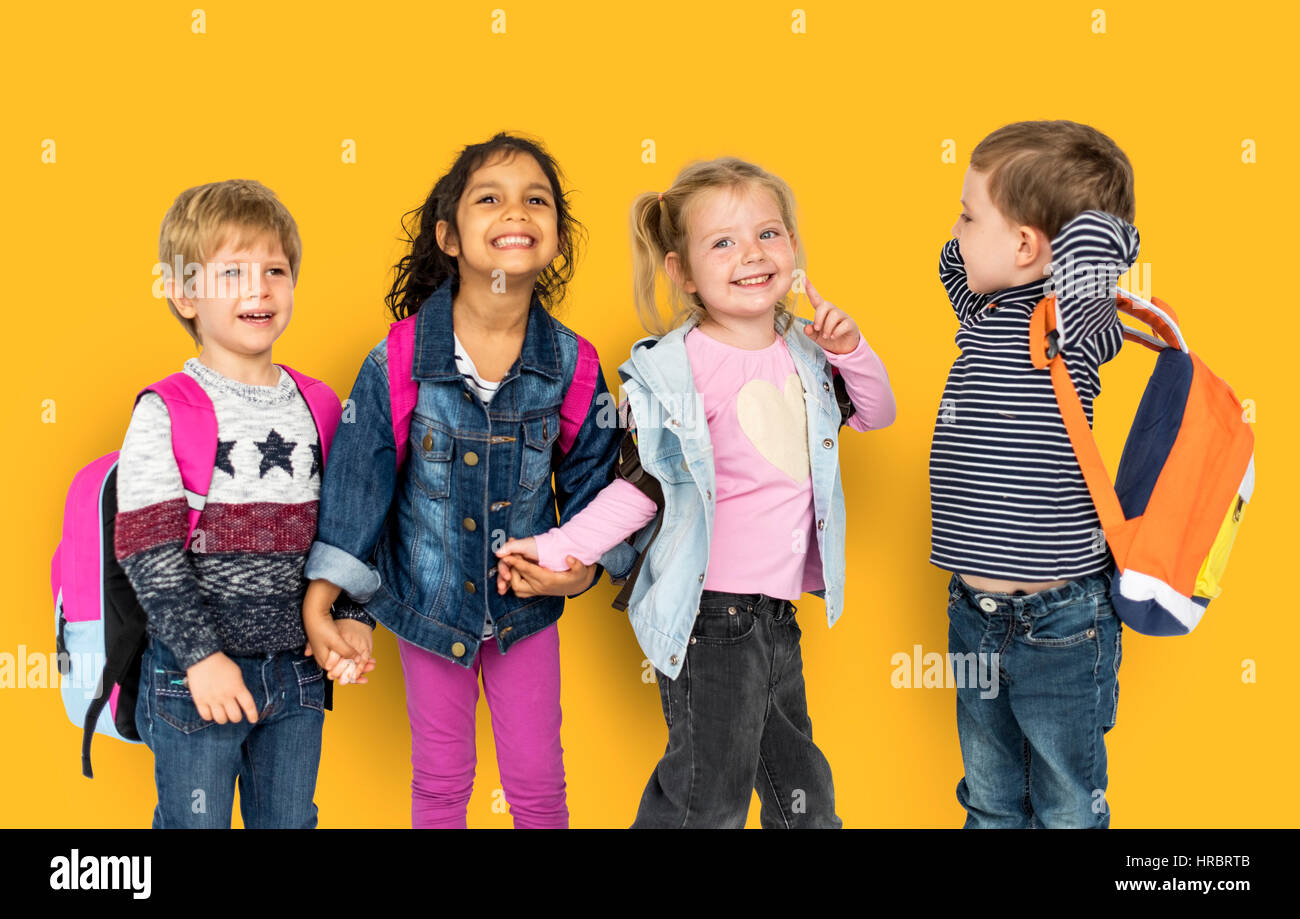 Little Kids Holding Hands Carrying Backpacks Stock Photo - Alamy
