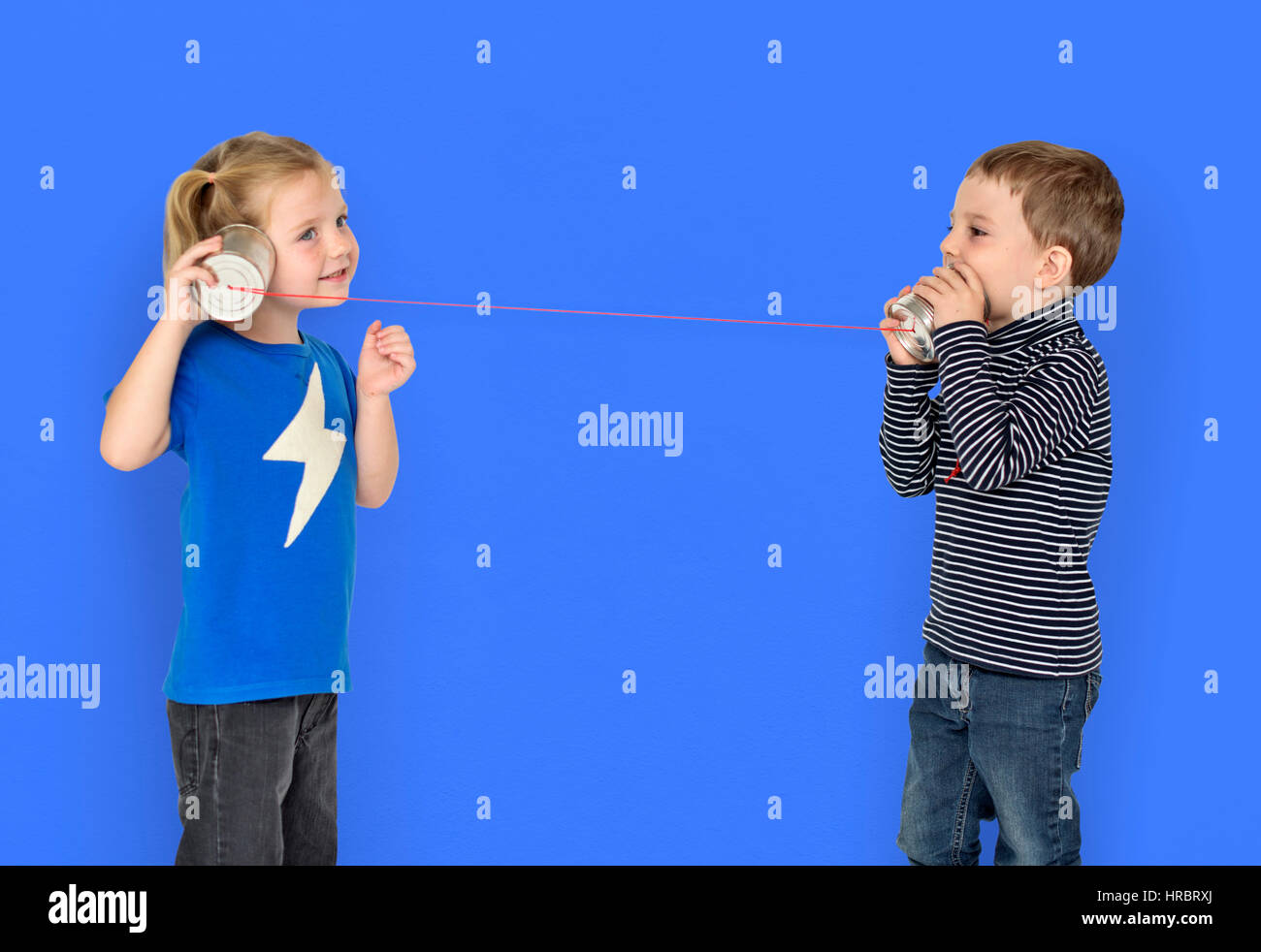 Little Kids Using String Phone Adorable Cute Stock Photo - Alamy