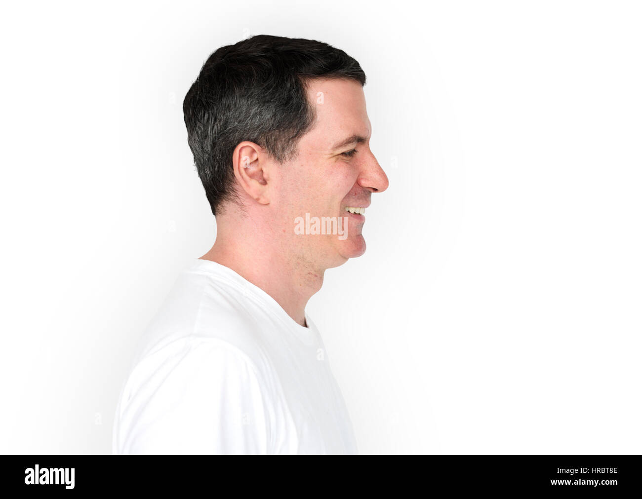 Caucasian Man Smiling Happy Side View Stock Photo - Alamy