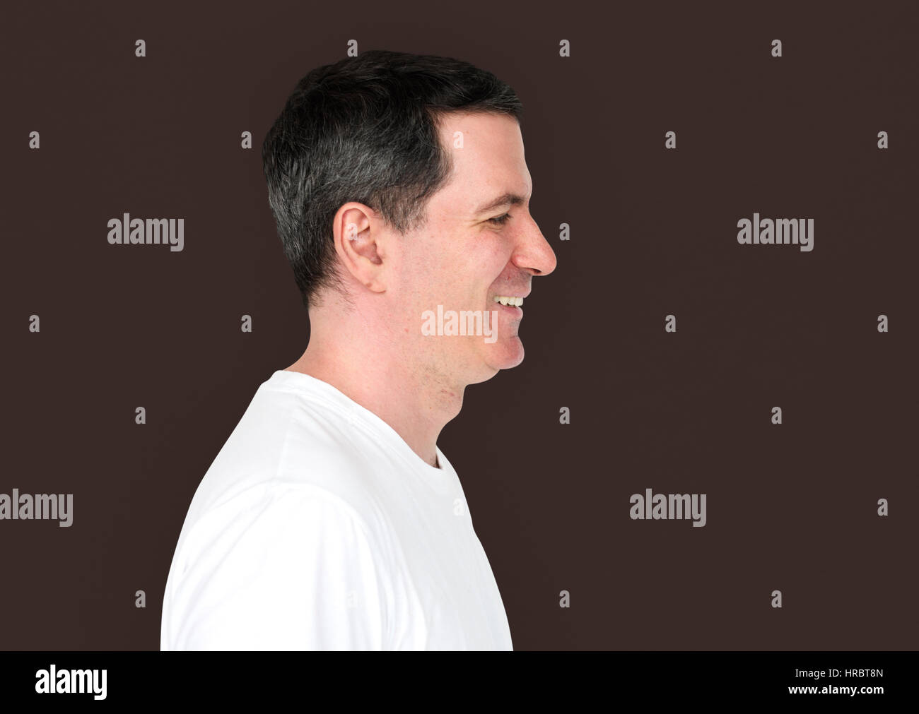 Caucasian Man Smiling Happy Side View Stock Photo - Alamy