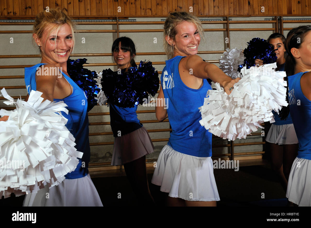Young cheerleaders team training in the gym Stock Photo - Alamy