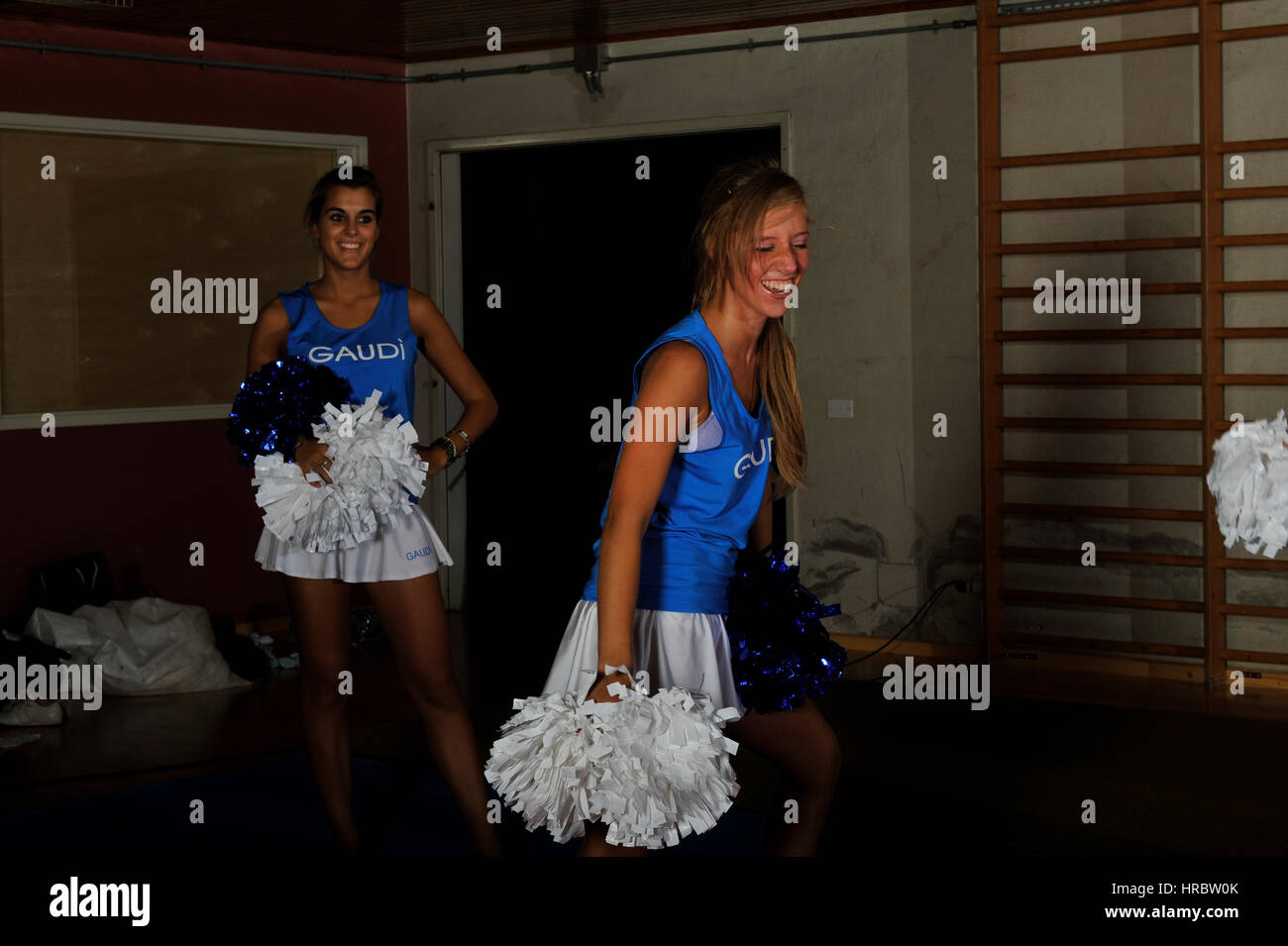 Young cheerleaders team training in the gym Stock Photo - Alamy
