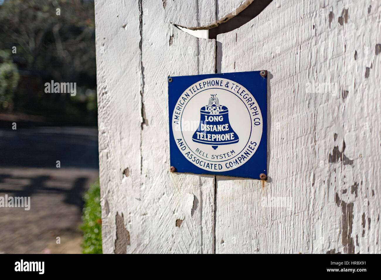Bell Telephone sign on the white-painted door of a vintage telephone ...