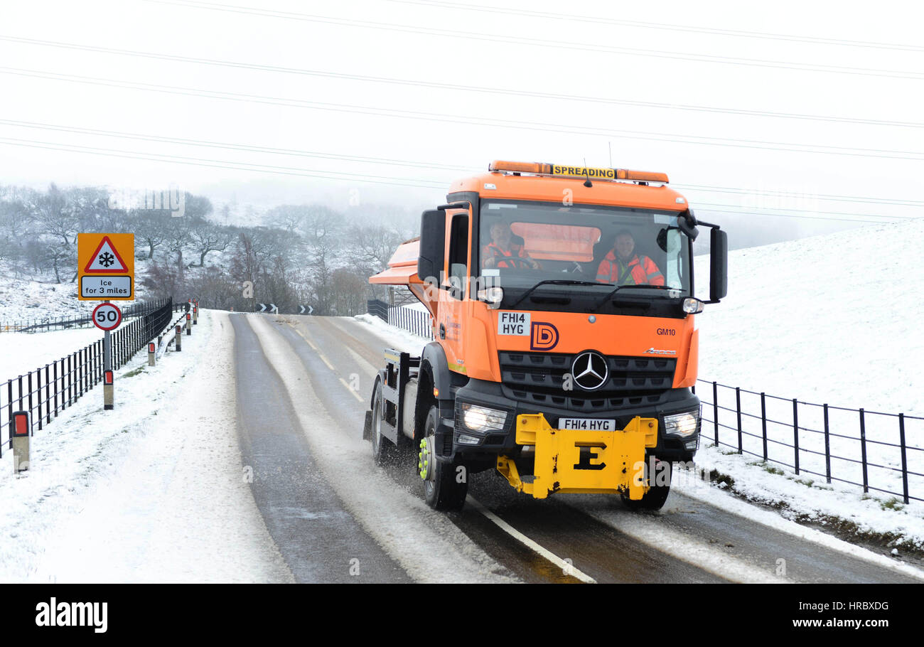 Last Day of Winter: A gritting vehicle travels along a snowy road near ...