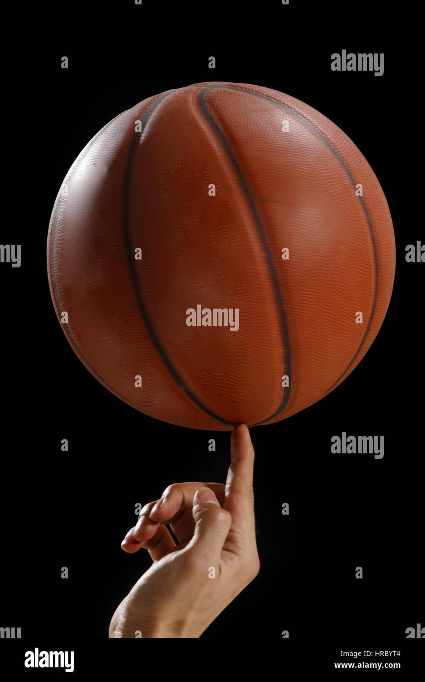 Young basketball player spinning ball hi-res stock photography and ...