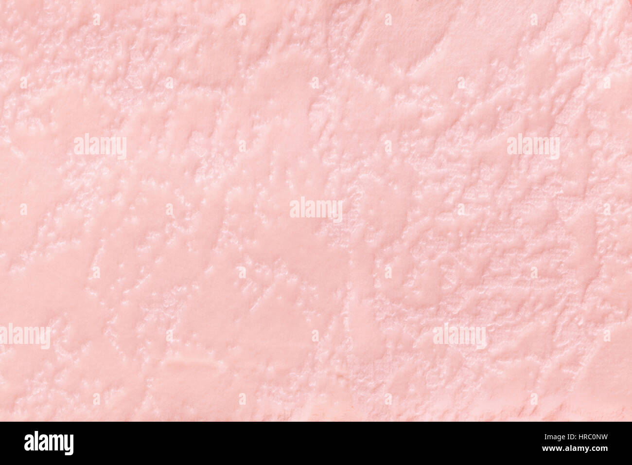 Light pink background from a soft upholstery textile material, closeup ...