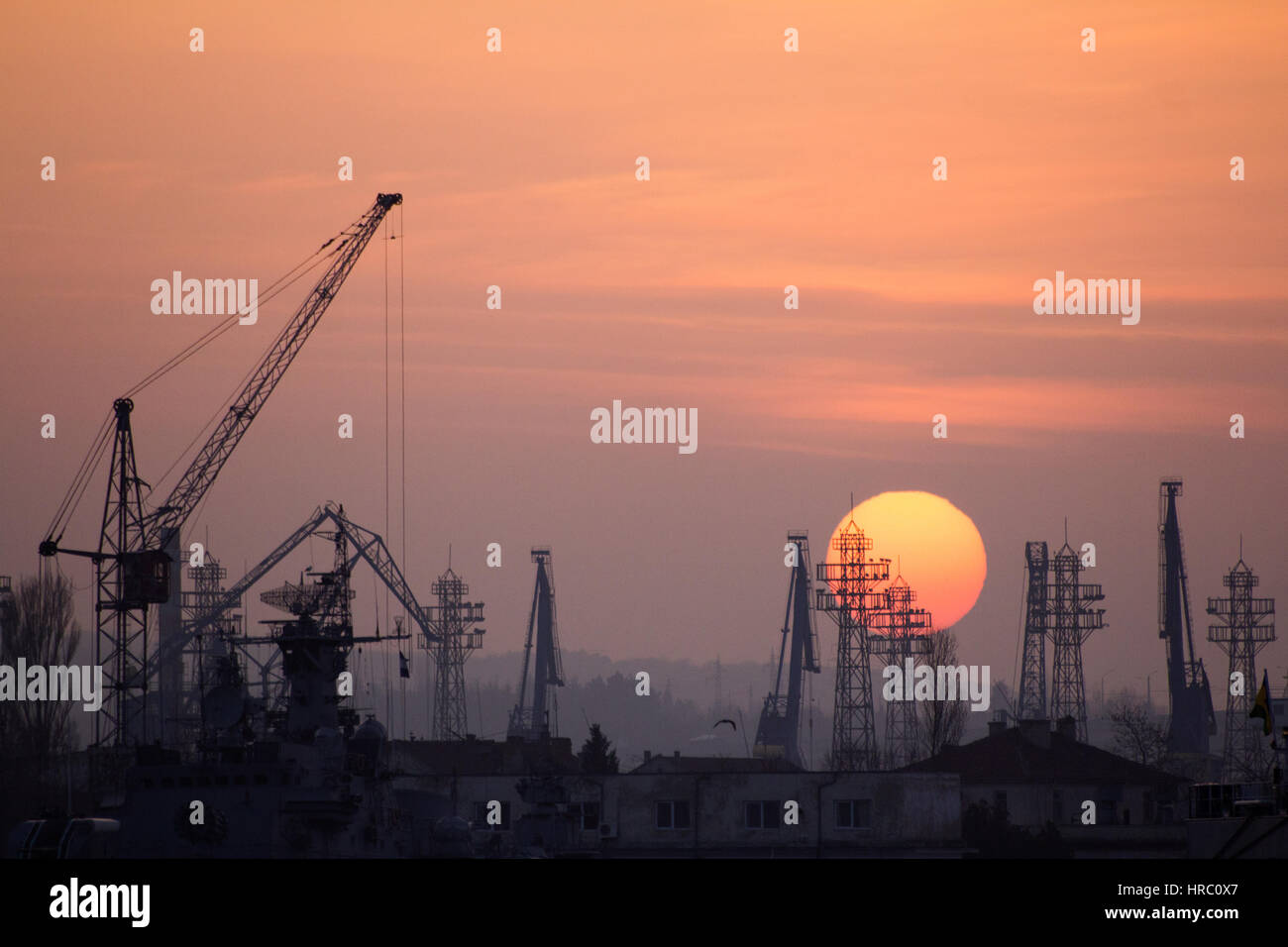 Industrial port dockyard with sunset Stock Photo - Alamy