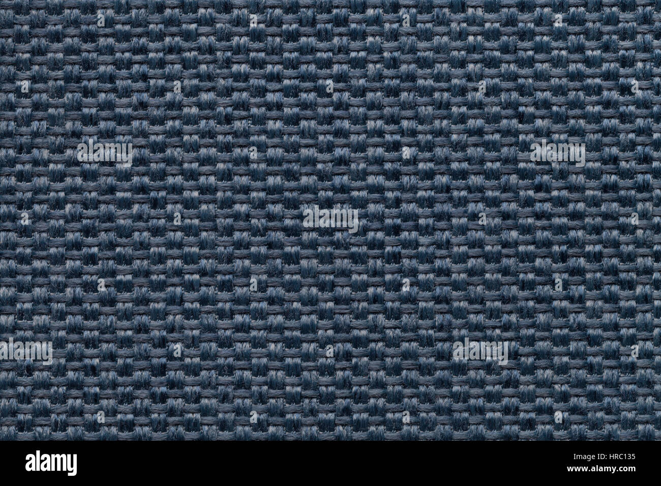 Navy blue background with checkered pattern, closeup. Structure of the ...