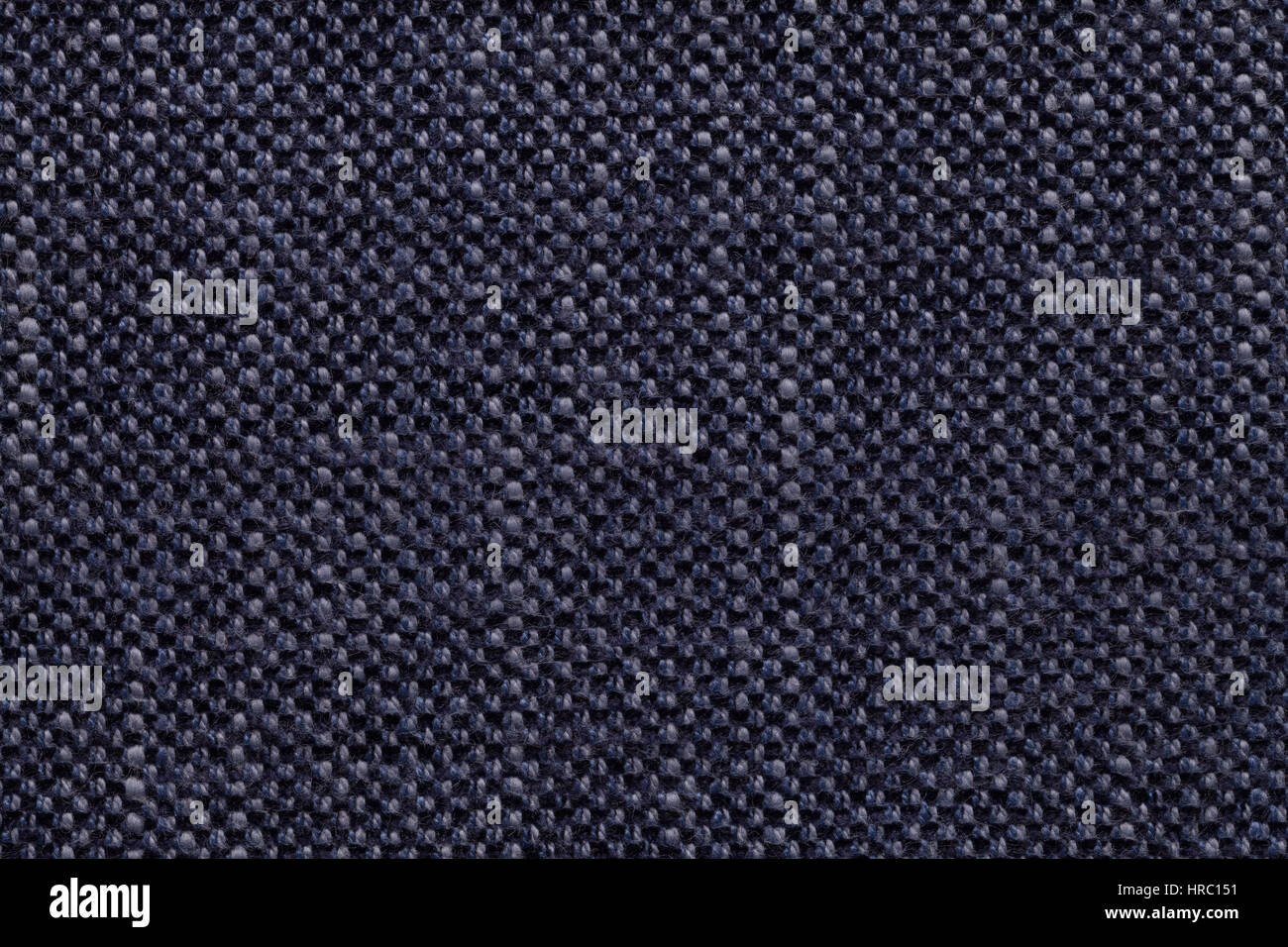 Navy blue background with checkered pattern, closeup. Structure of the ...