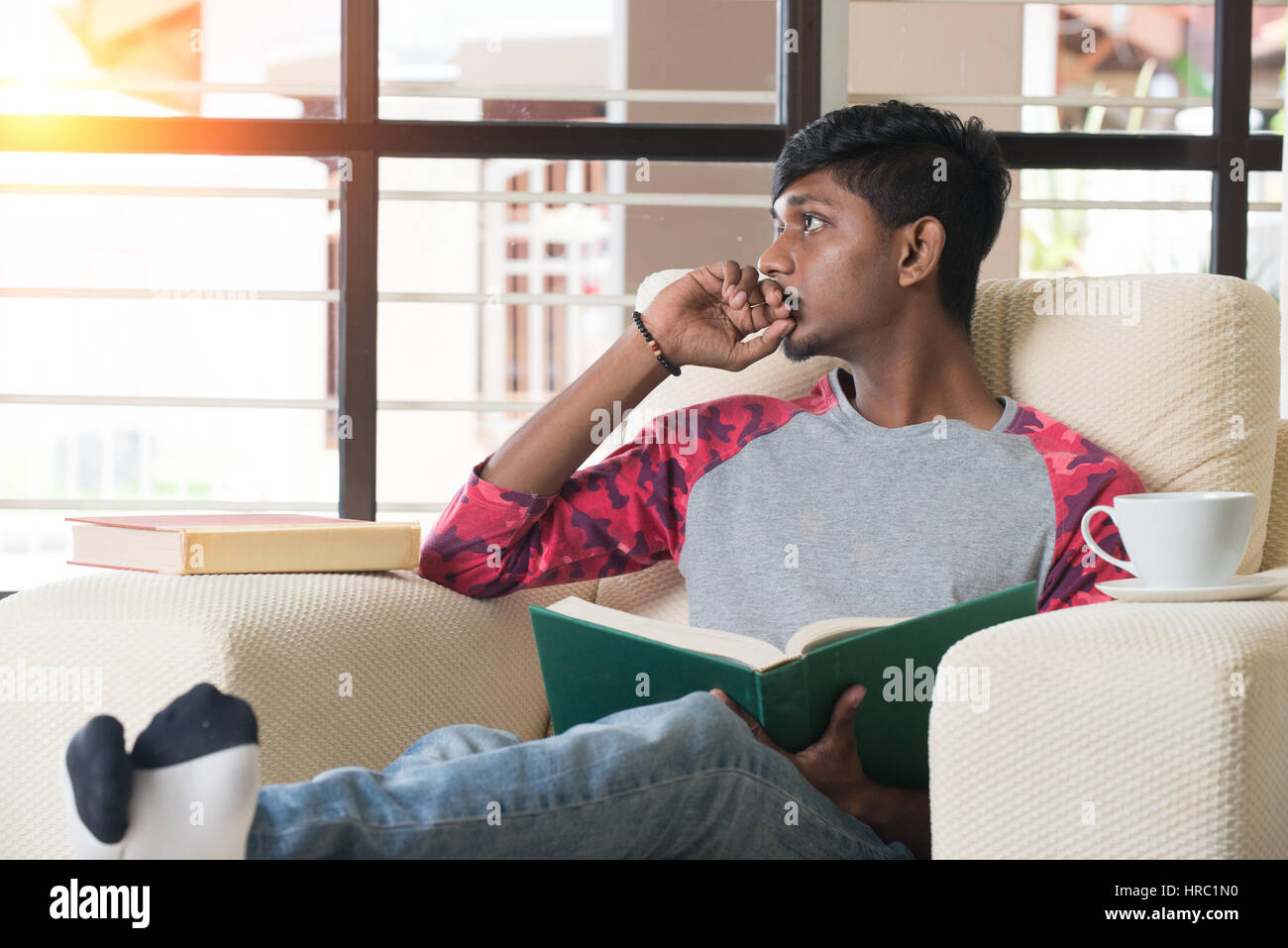 indian teenage male reading Stock Photo - Alamy