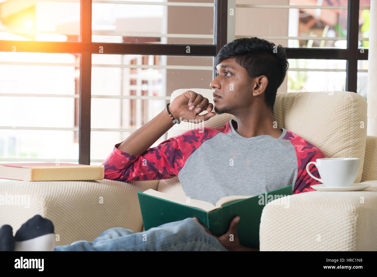 indian teenage male reading Stock Photo - Alamy