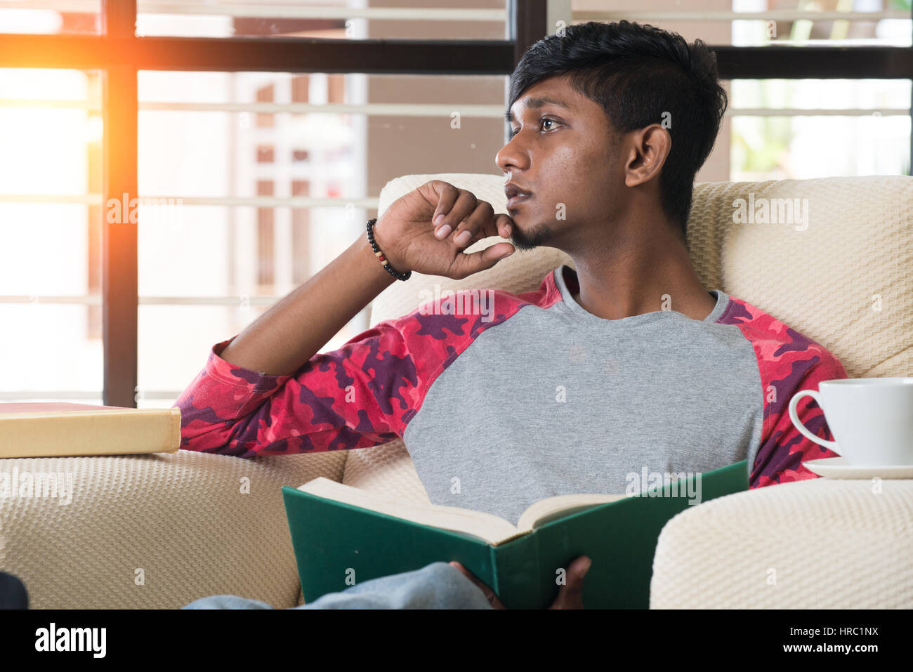 indian teenage male reading Stock Photo - Alamy