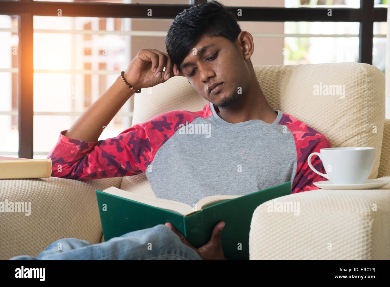 indian teenage male reading Stock Photo - Alamy