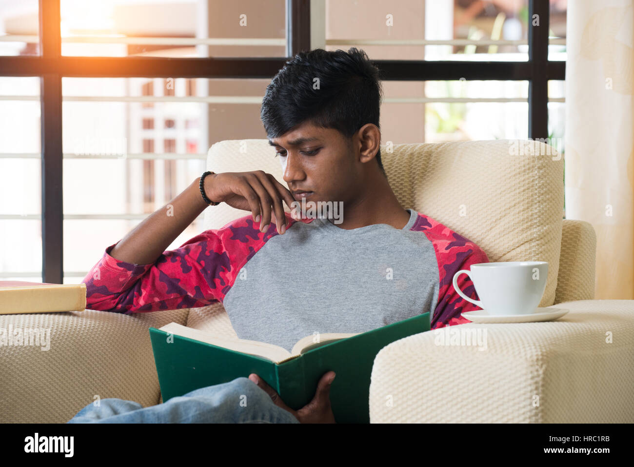 indian teenage male reading Stock Photo - Alamy