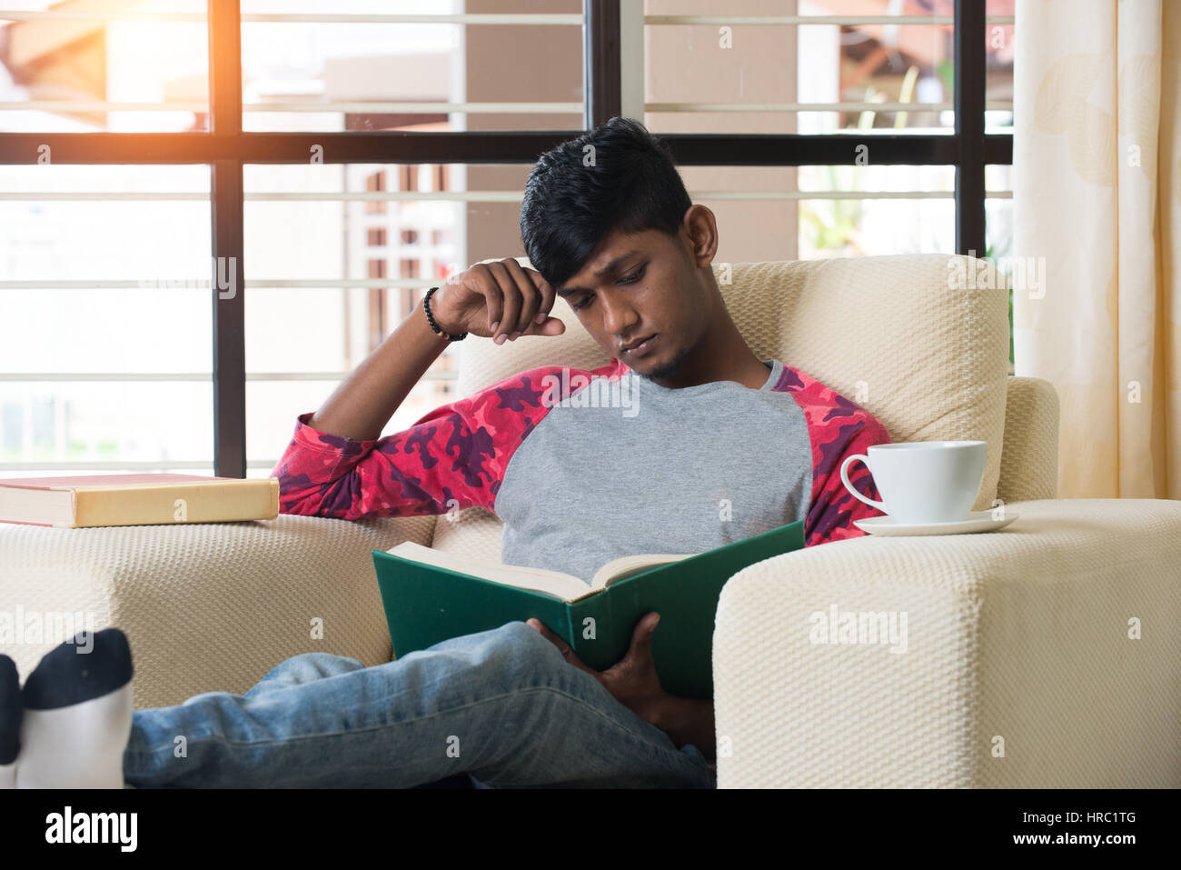 indian teenage male reading Stock Photo - Alamy